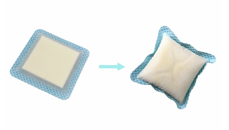Super absorbent wound dressings with non-adherent contact layer